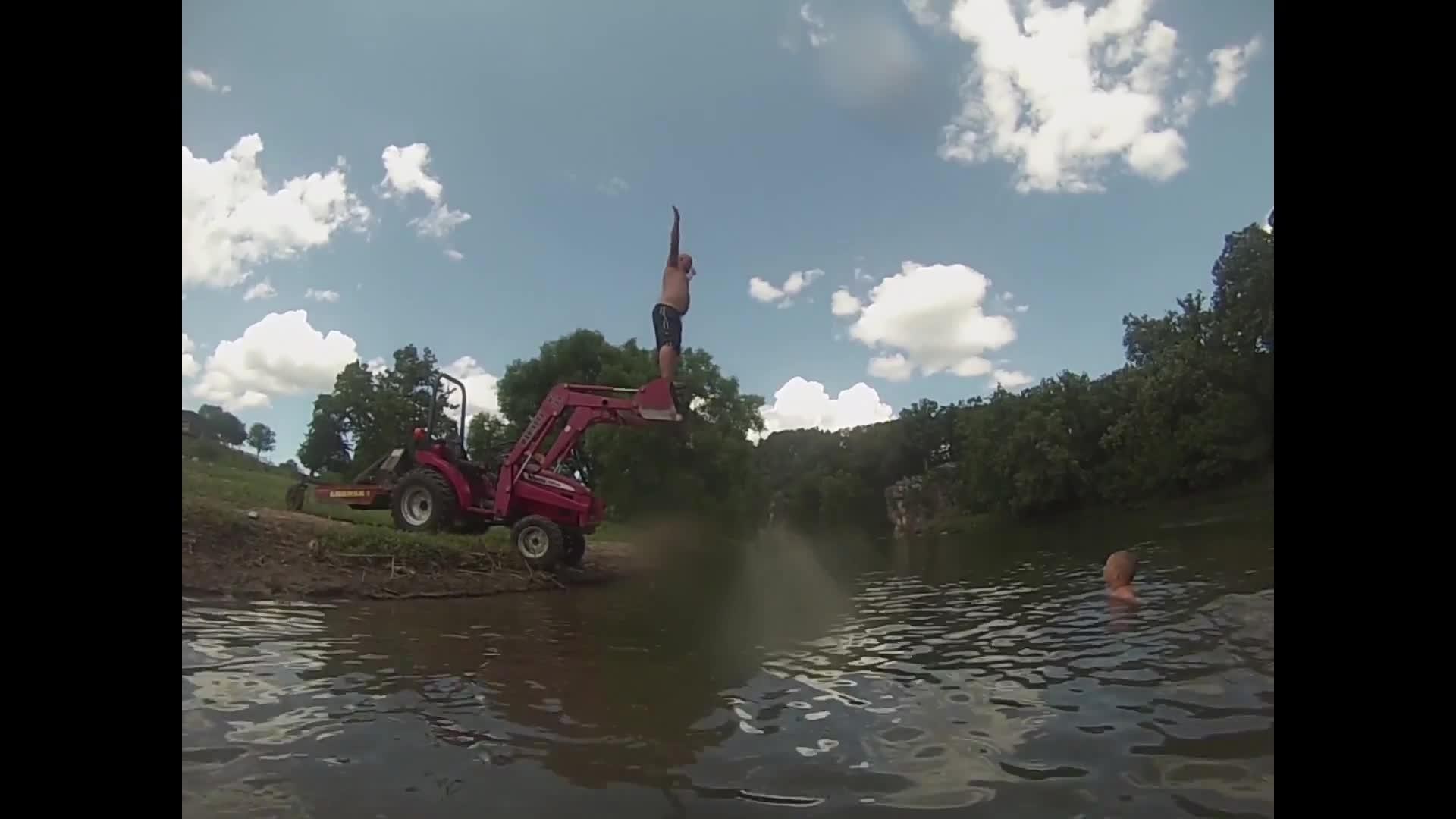 Drunk Guy Falls off Tractor into River | Jukin Licensing