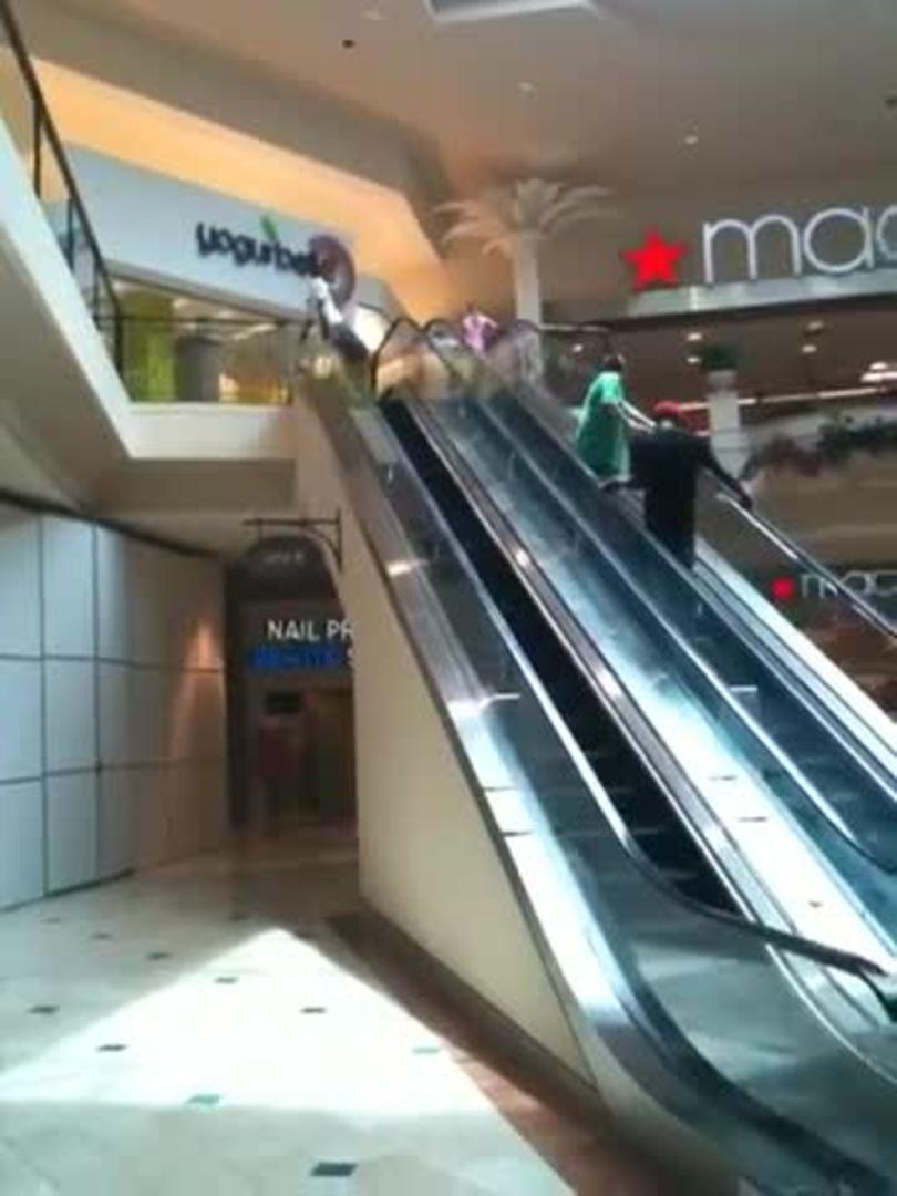 Guy Falls Sliding on Escalator Rail | Jukin Licensing