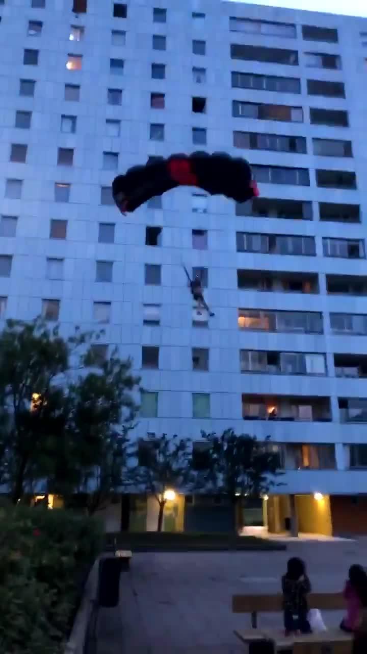 Guy Parachutes from Twelve-Story Building Window | Jukin Licensing