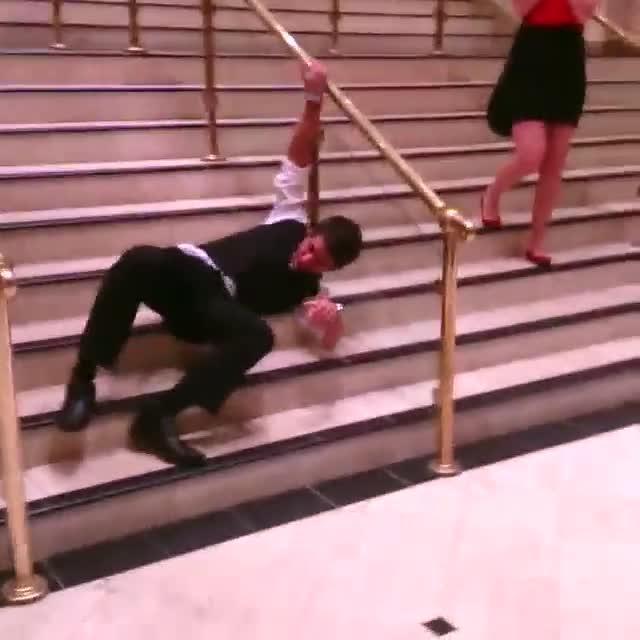 Guy Screams as He Falls Over Backwards While Sliding on Wet Wooden ...