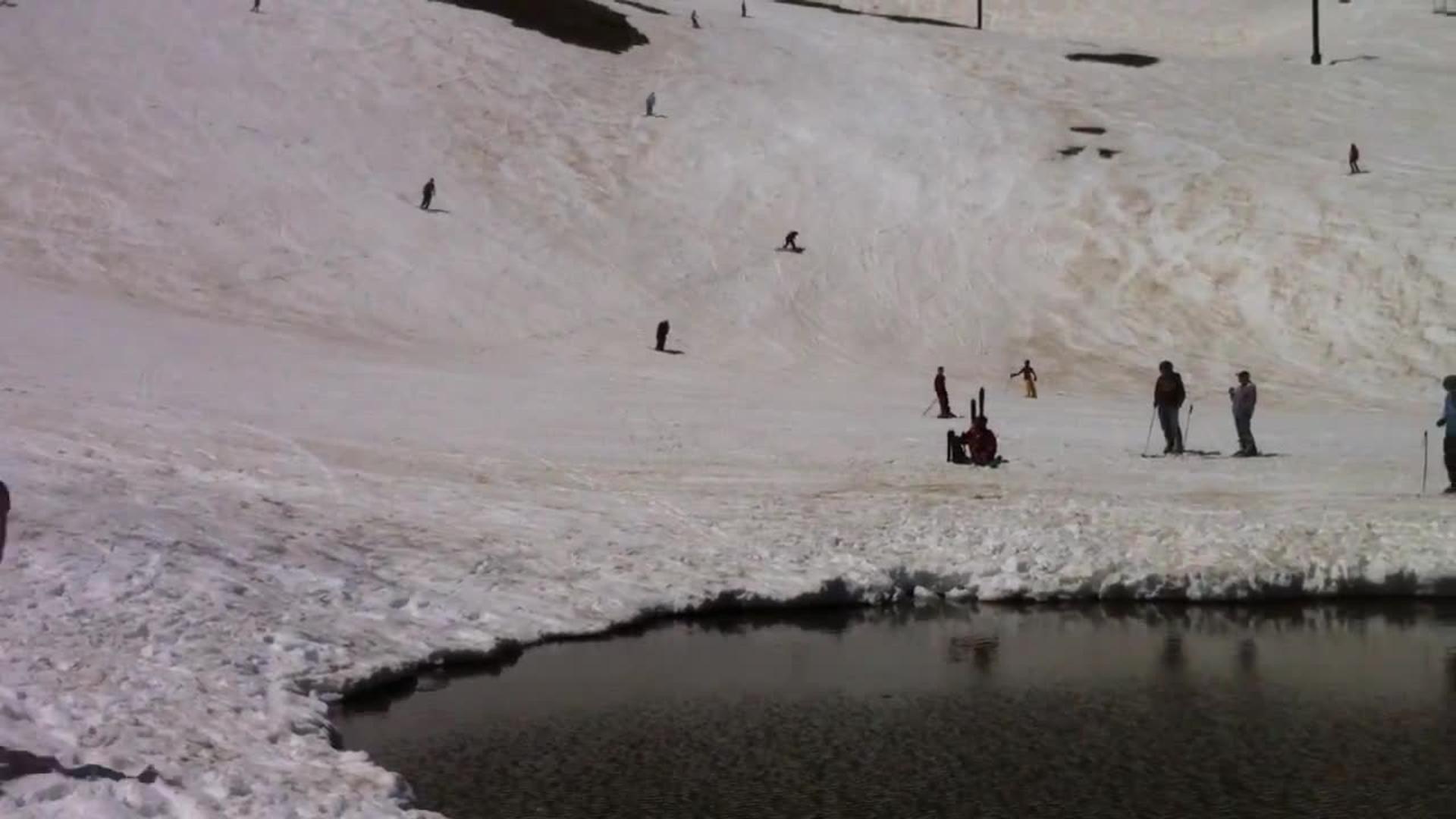 Snowboarder and Skier Skim Across Pond Successfully | Jukin Licensing