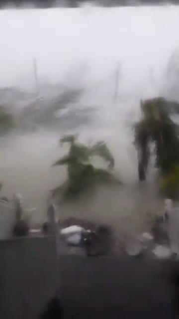 Hurricane Hits Coastal Area in Bahamas Flooding Nearby Houses and ...