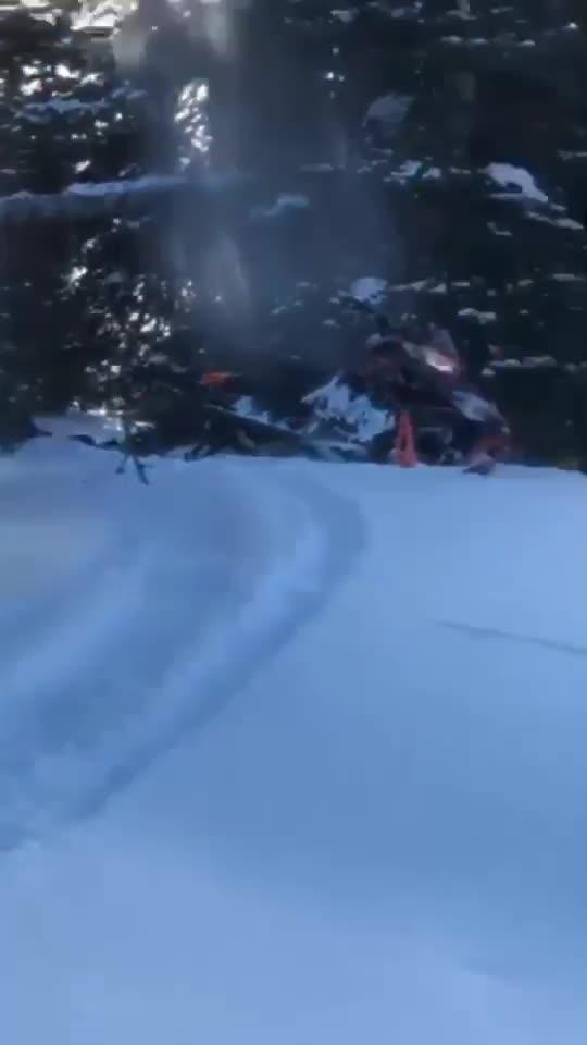 Guy Riding Snowmobile Collides With Wood Log and Flips While Falling on ...