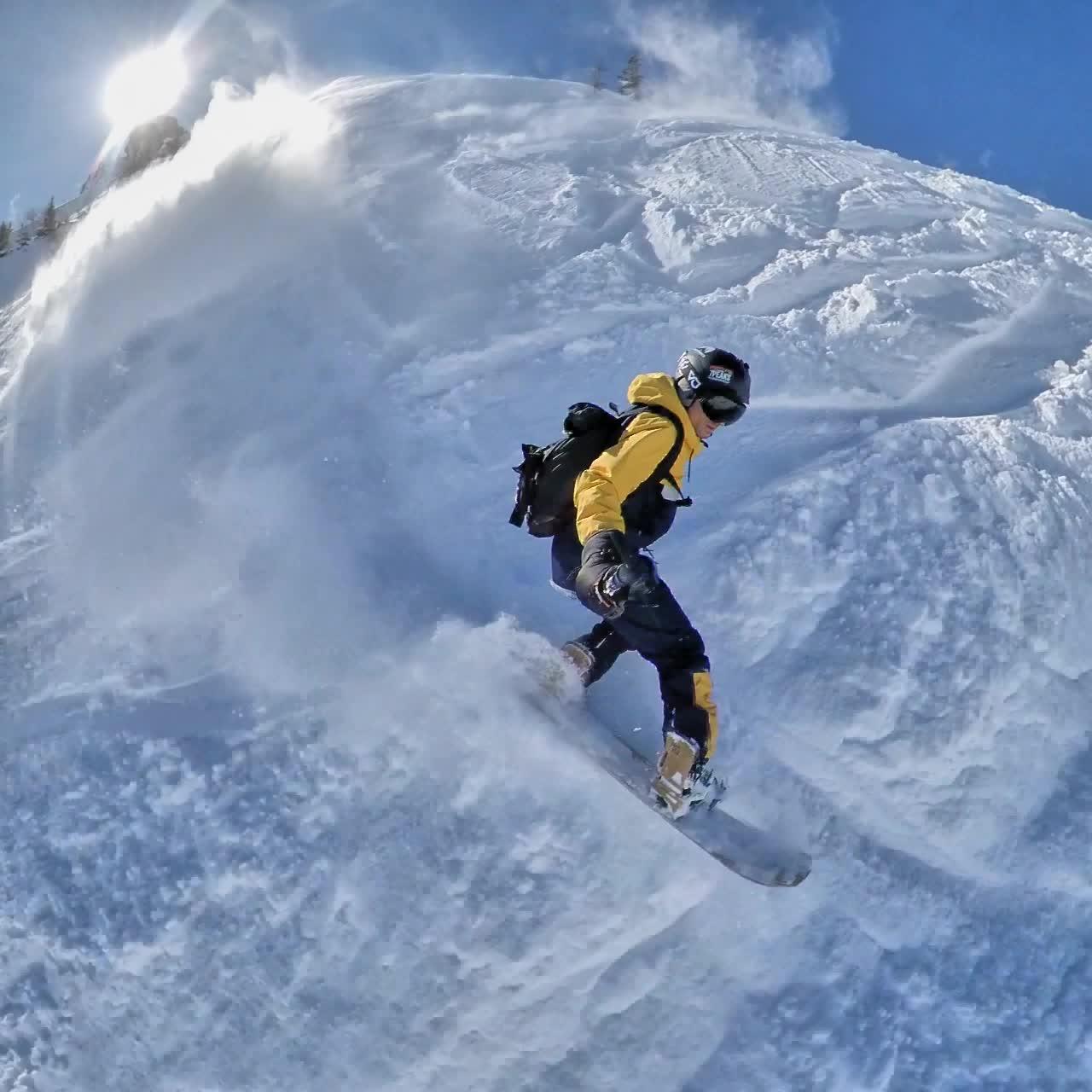 Guy Speeds Down From Mountain Top on his Snowboard | Jukin Licensing