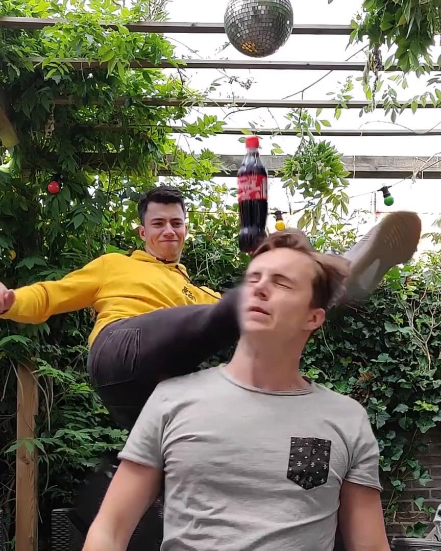 Guy Fails While Performing Bottle Cap Challenge as He Kicks His Friend ...