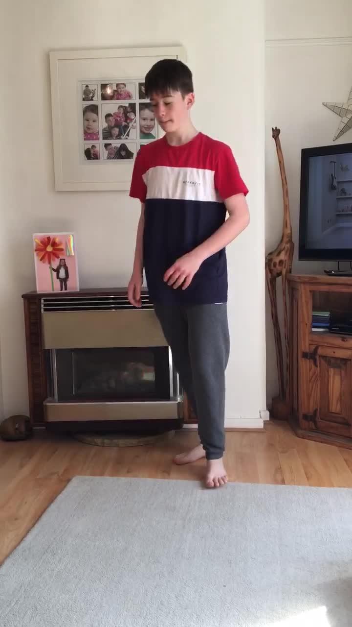 Boy Slips and Falls on Floor While Trying to Kick Toilet Paper Roll ...