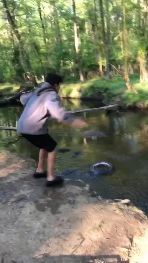 Girl Loses Grip While Rope Swinging and Falls in Water | Jukin Media Inc
