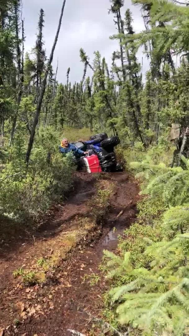 Man Falls Off ATV as it Topples on Muddy Road | Jukin Licensing