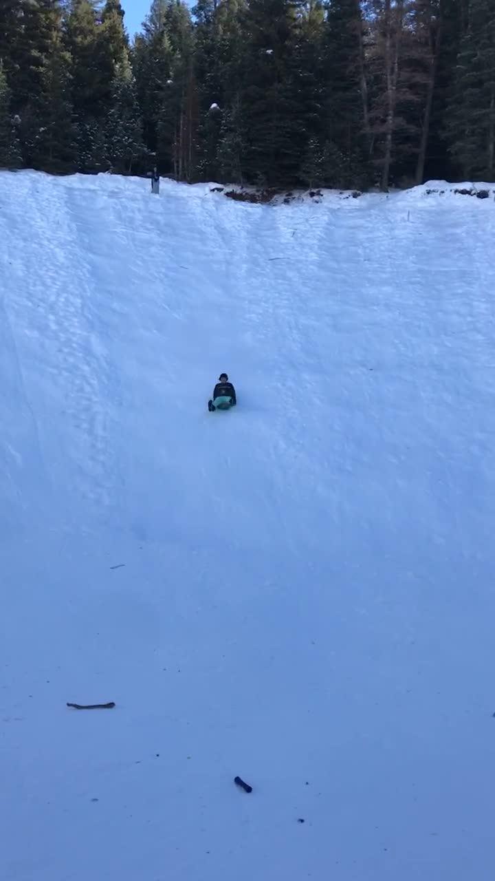 Sledding Kid Falls Off Sled After it Hits Bump | Jukin Media Inc