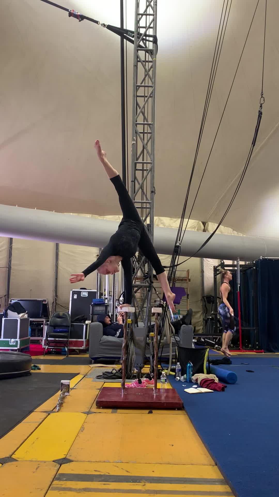 Woman Falls to the Ground While Doing One-Handed Handstand on Canes ...