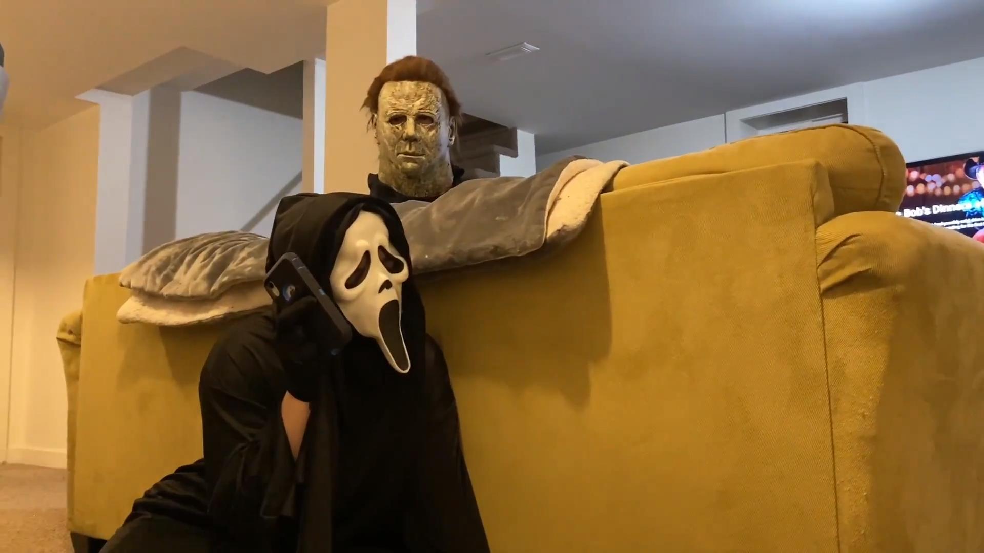 Tall Guy Wearing Scary Costume Pranks Another Guy By Hiding in Dark ...