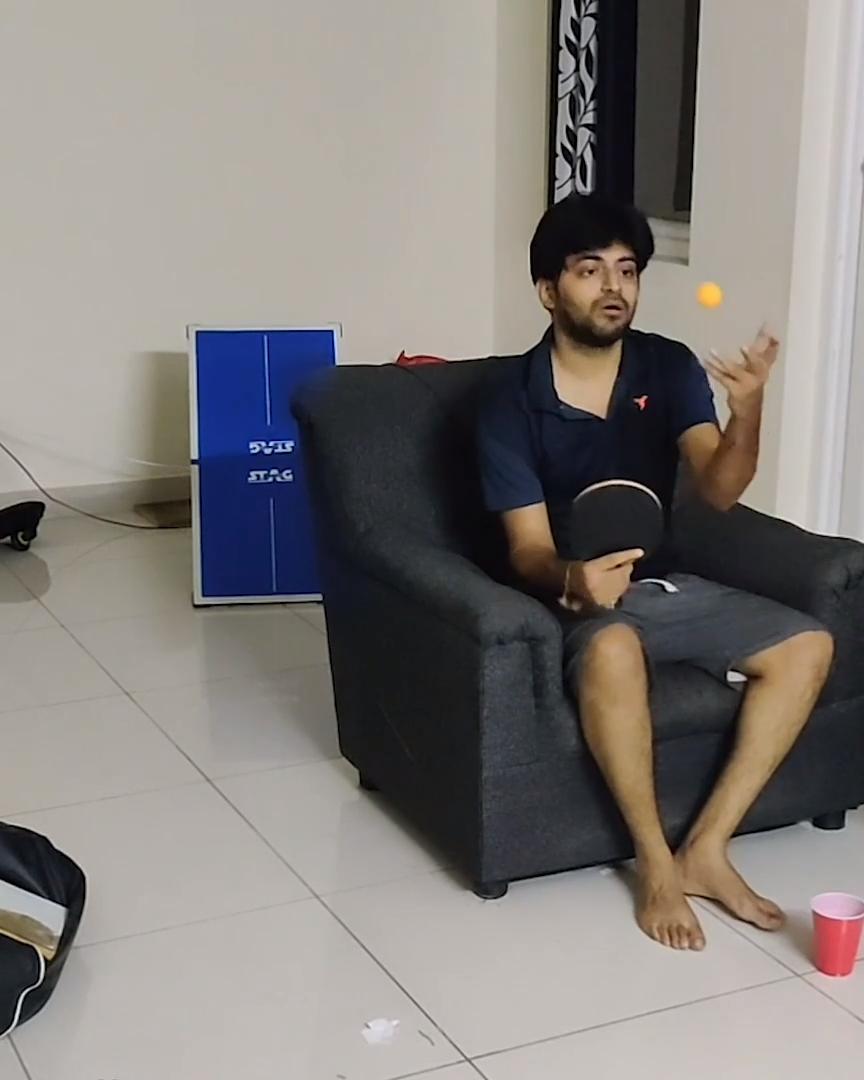 Guy Does Amazing Ping Pong Ball and Cup Trick While Sitting in Chair ...