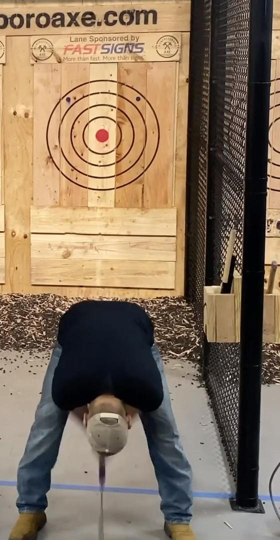 Guy Turns His Back Towards Target And Throws Axe at it | Jukin Licensing