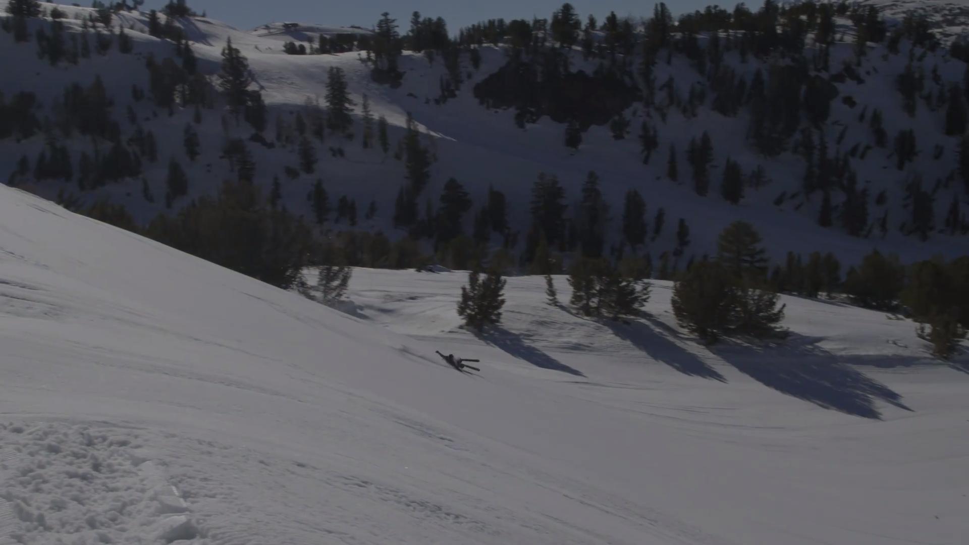 Guy Attempts Jump Over Snow Ramp While Skiing And Slides Downhill On ...