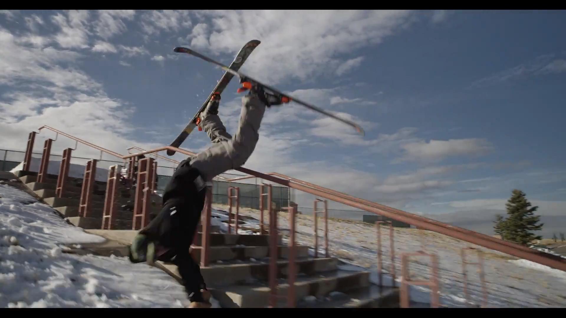 Skier Launches off Snow Ramp to Grind on Rail and Topples Mid Way ...