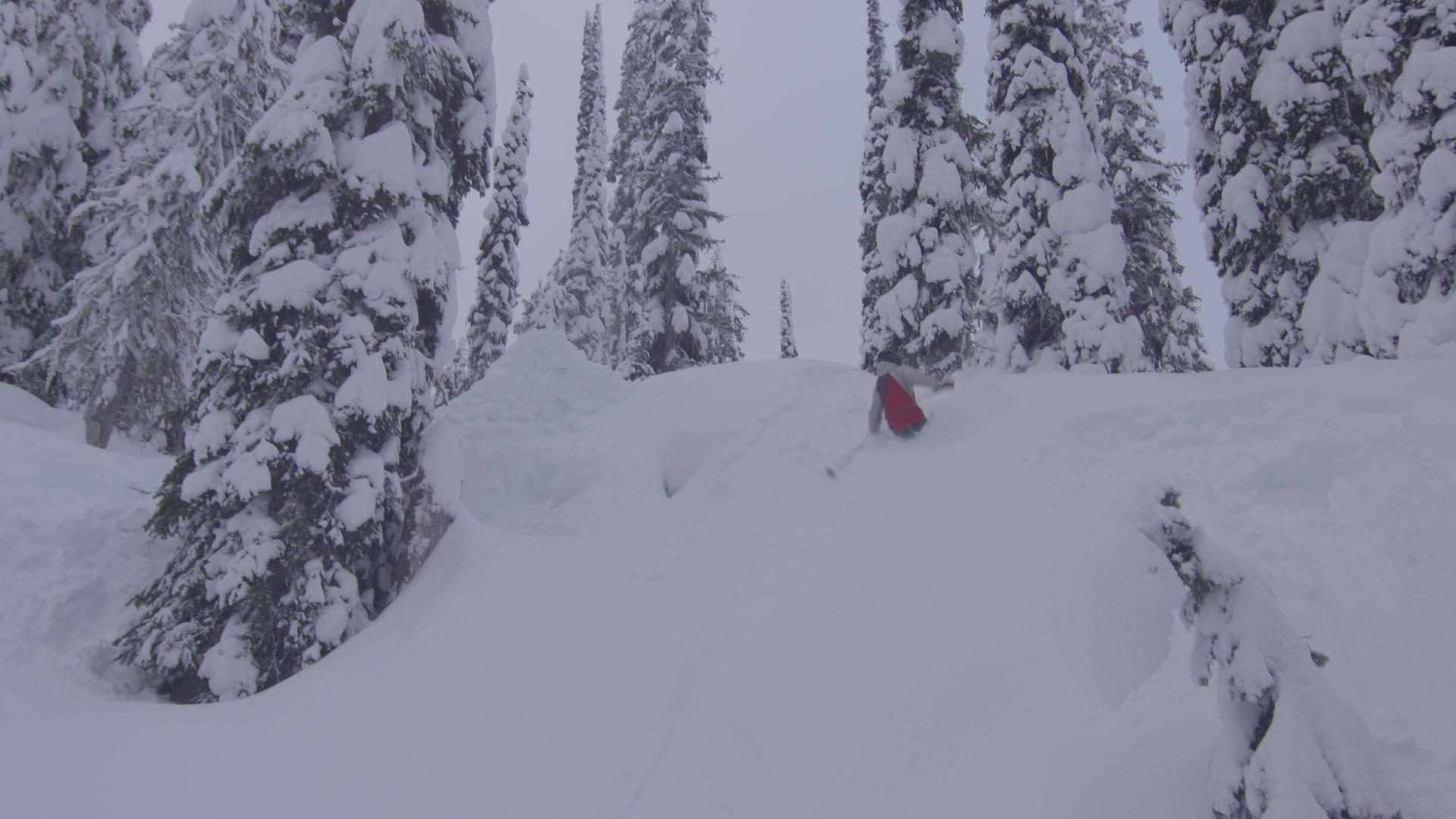 Depression Forms in Snow as Skier Falls into it After Jumping From Snow ...