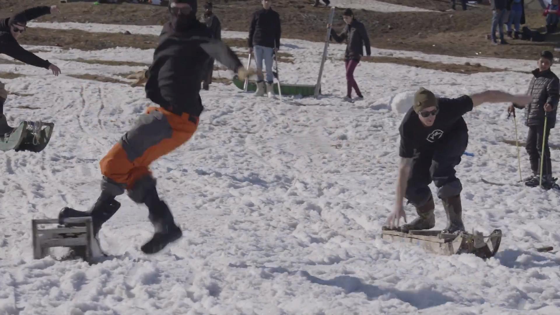Guys Crash in Snow While Racing Downhill on Sleds | Jukin Licensing