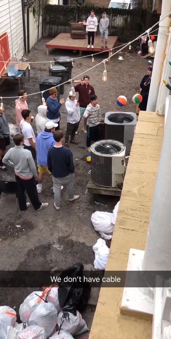 Guys Watch Two Inflatable Balls Fight Each Other On Top Of Air Vent ...