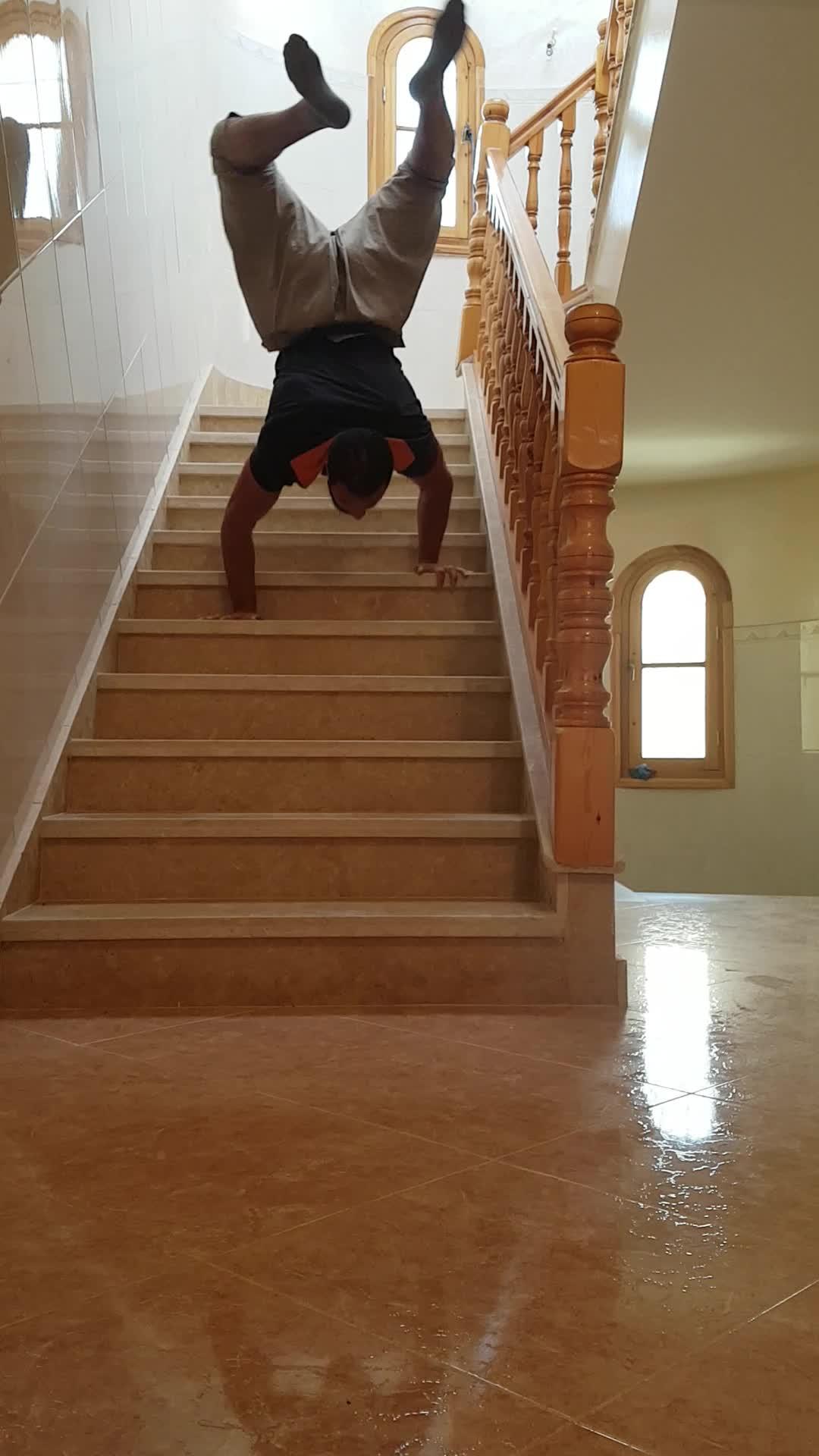 Guy Falls Face-First Trying to Walk Down Staircase While Doing ...