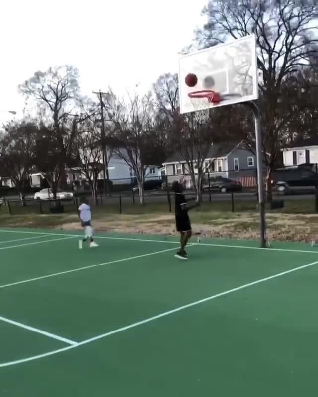 Kid Showcases Basketball Skills by Playing Lay Up Shots to Score ...