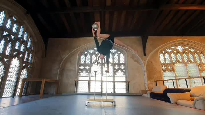 Circus Performer Tries Ball And Leg Manipulation In Handstand Position ...