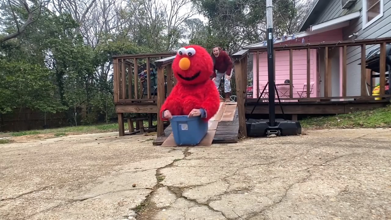 Couple Take Turns to Go Ice Sliding off Icy Deck Ramp While Sitting ...