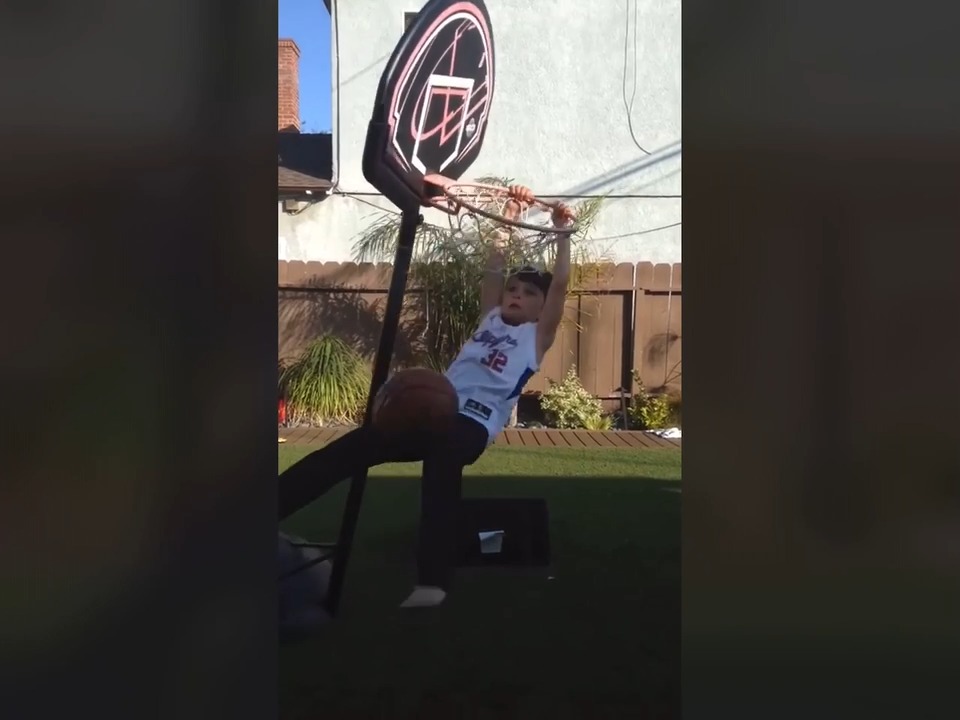 Little Kid Falls While Attempting To Slam Dunk Basketball | Jukin Licensing