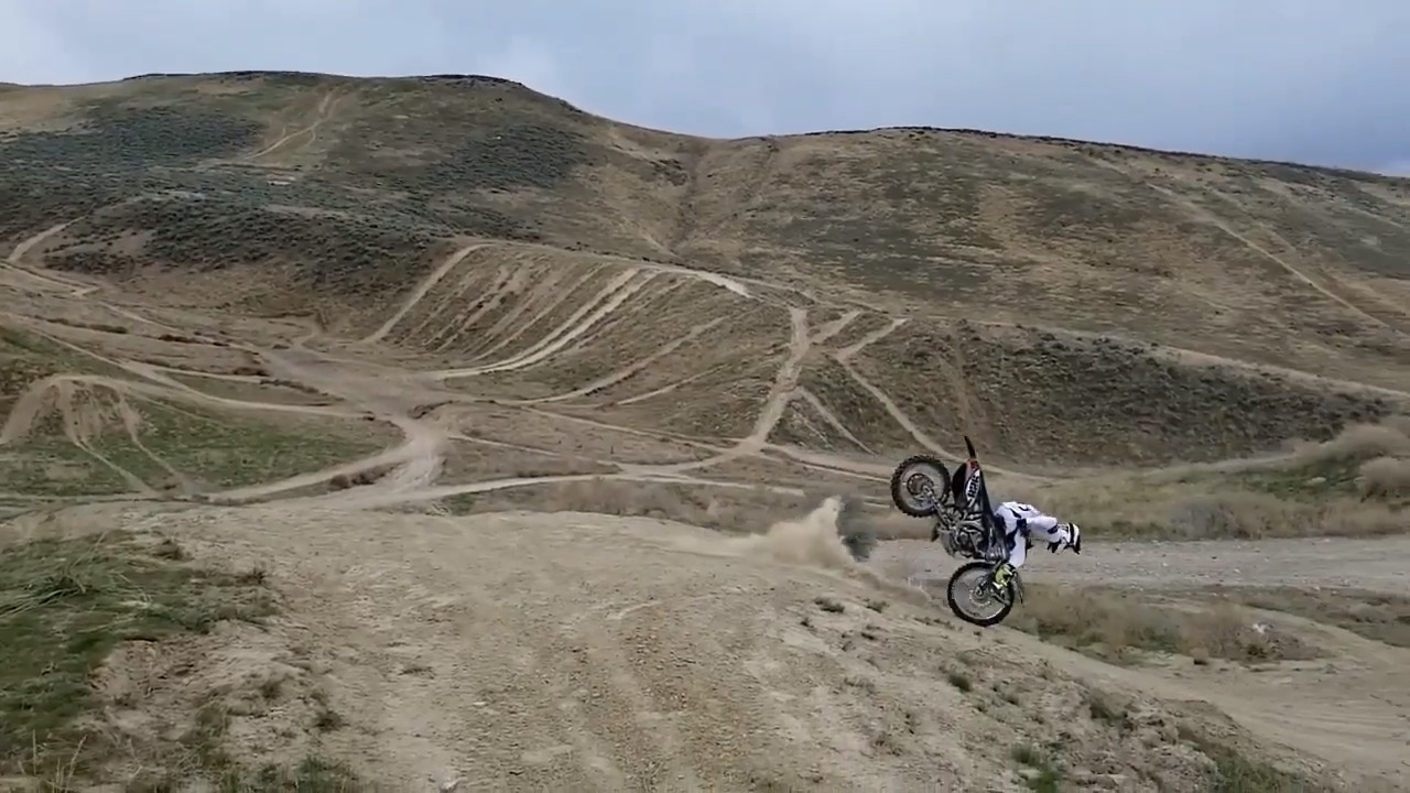 Biker Faceplants to the Ground While Jumping Over Uneven Terrain ...