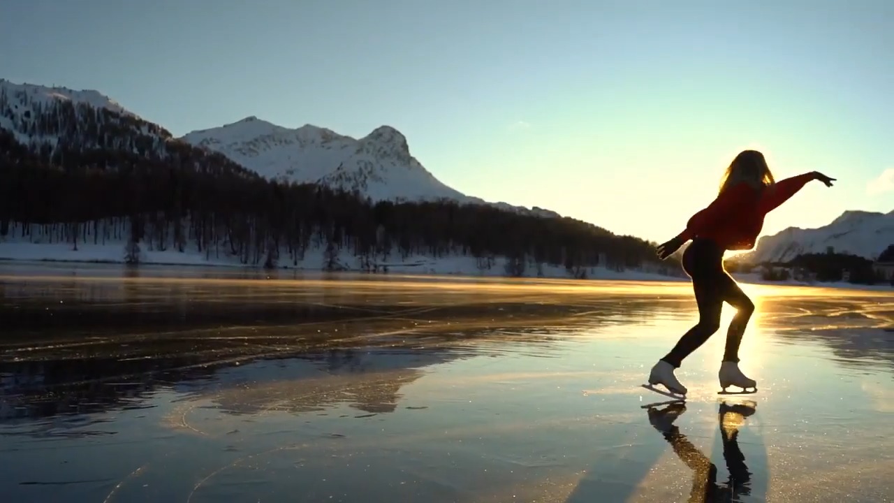 Girl Performs Amazing Ice Skating Act Amidst Mountains In Switzerland ...