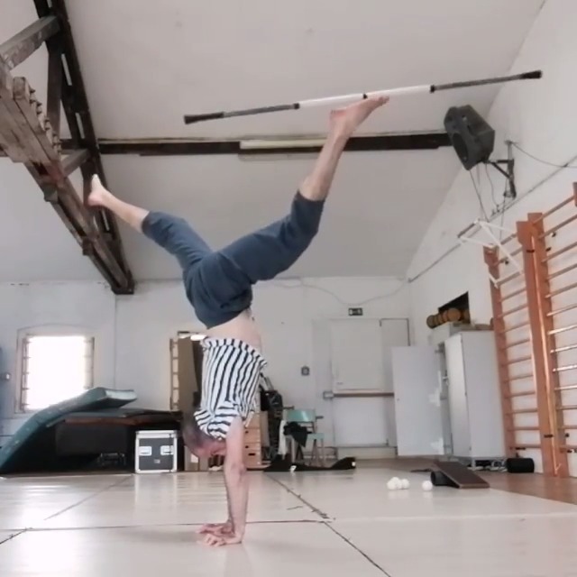 Guy Rotates Stick Over Foot While Performing Handstand | Jukin Licensing