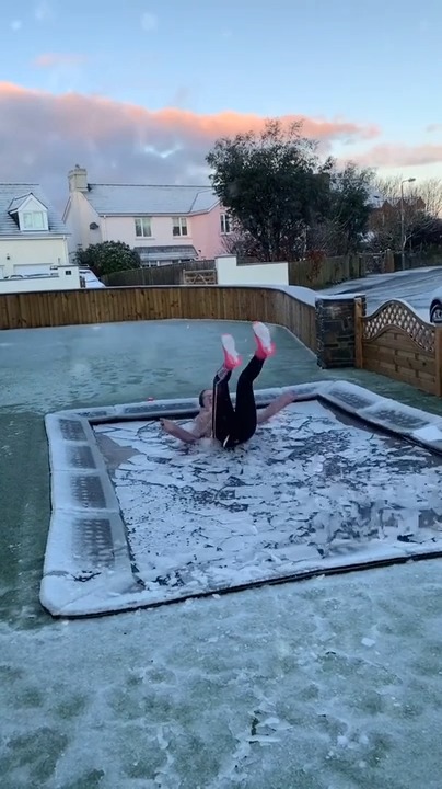 Girl Slips And Falls on Frozen Trampoline While Trying to Jump on it ...