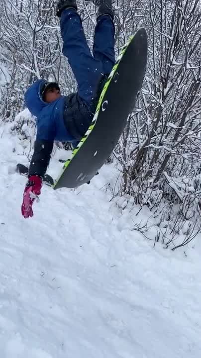 Kid Sledding Down Snowy Slope Falls Over Backwards | Jukin Licensing