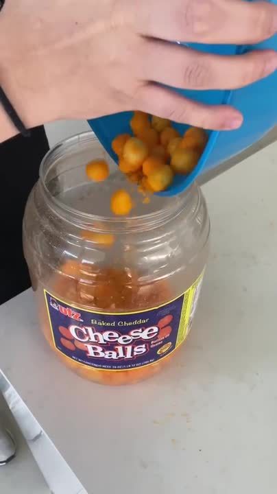 Guy Pranks Friend by Cutting Bottom of Cheese Balls' Container | Jukin ...