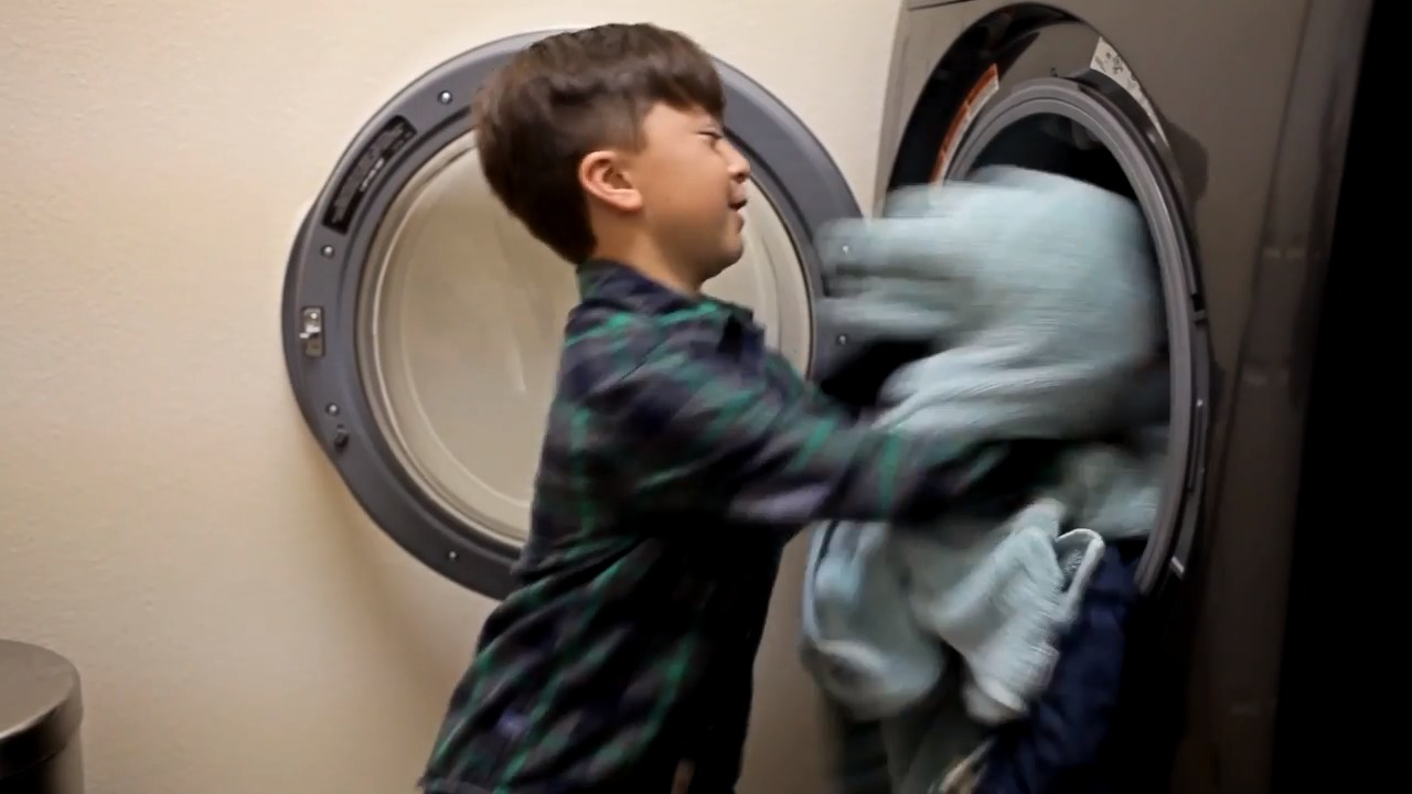 Kid Puts Clothes in Washing Machine | Jukin Licensing