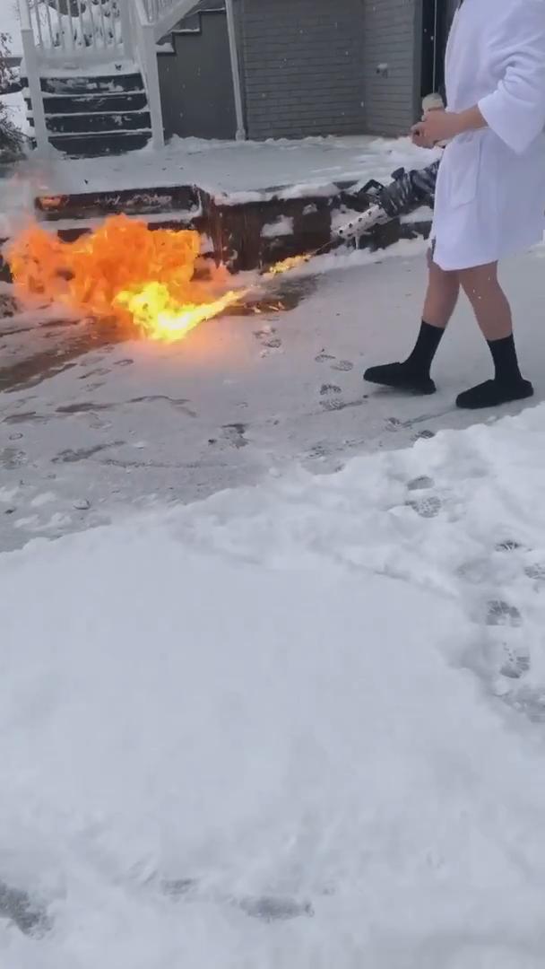 Guy Uses Flamethrower To Melt Snow From His Driveway | Jukin Media Inc