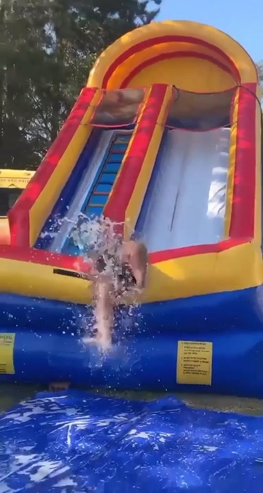 Woman Falls And Hits Ground While Sliding Down Water Slide | Jukin ...