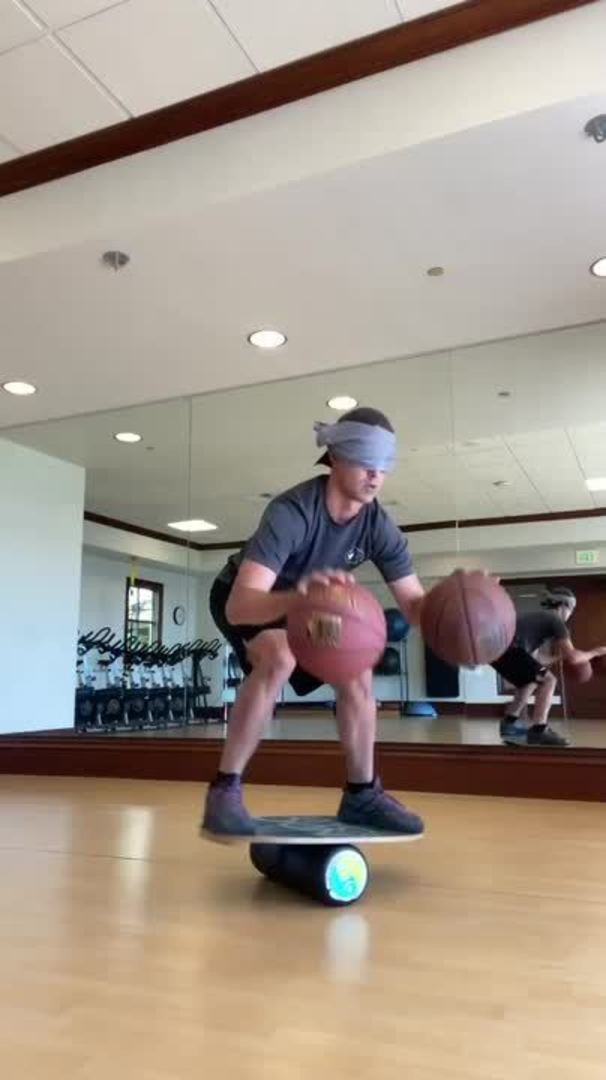 Man Displays Impressive Basketball Dribbling Skills While Standing Atop ...