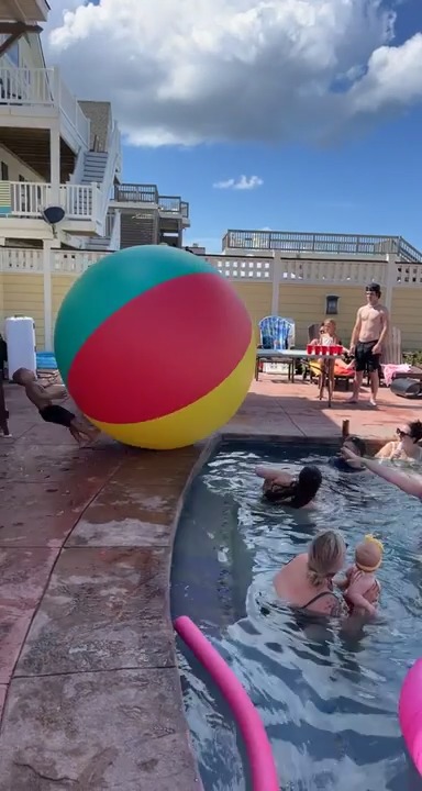 Little Boy Gets Knocked Down by Giant Beach Ball While Trying to Catch ...