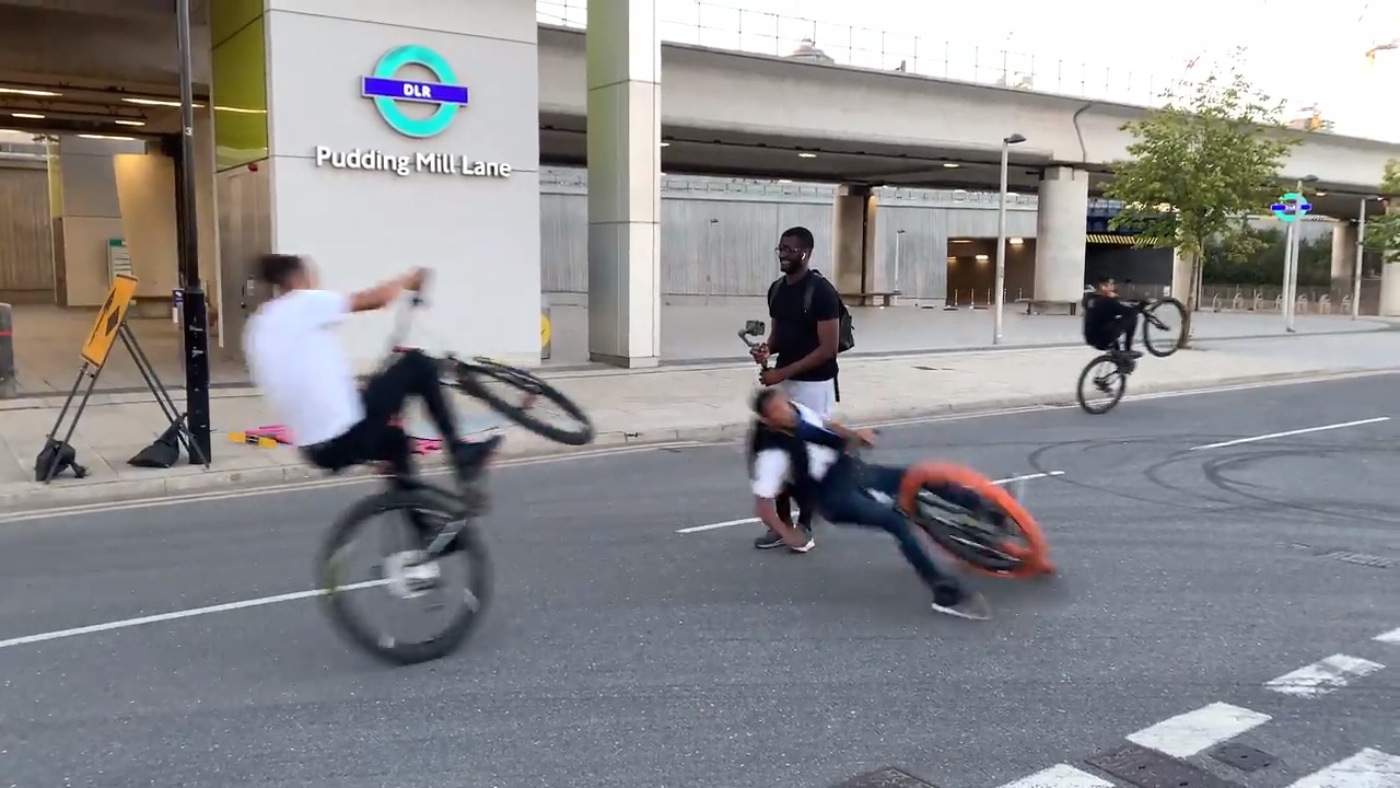 Bicyclist Tries to Swerve Away From Person Standing on the Road and ...