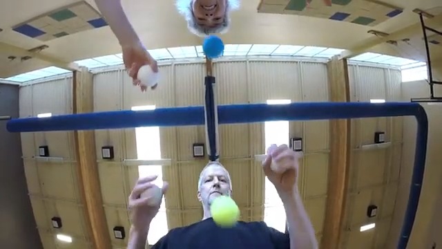 Couple Does Bounce Juggling Pass With Multiple Balls Over Tabletop ...