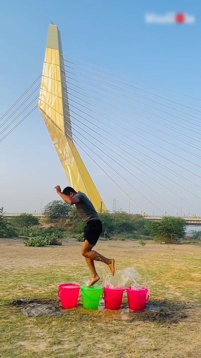 Guy Jumps and Skims Over Water in Buckets | Jukin Licensing