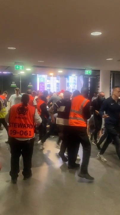 Security Struggle To Hold Off Football Fans Trying to Storm Into ...