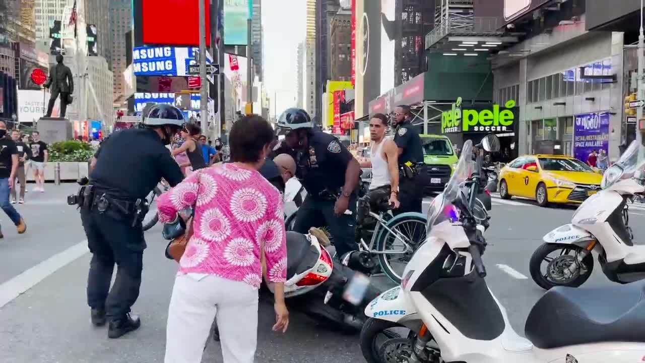 Cop on Scooter Falls on Busy Road After Guy Doing Wheelie on Bike ...