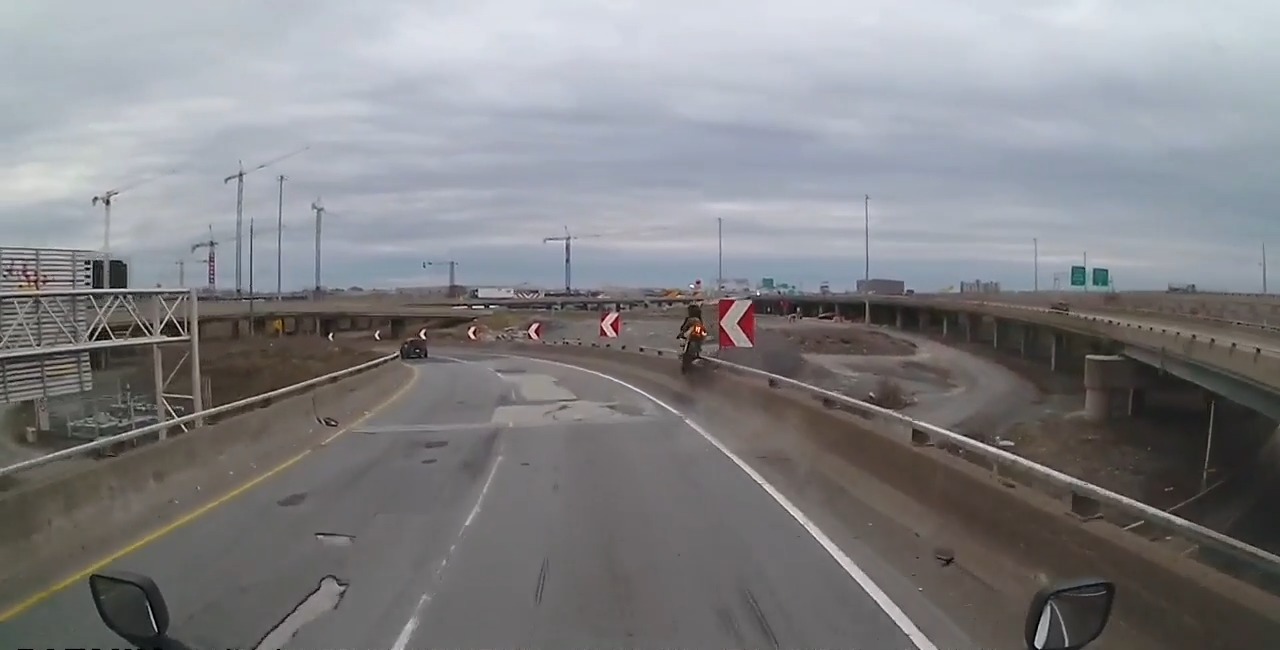 Motorcyclist Hits Guard Rail and Falls Off Overpass | Jukin Licensing