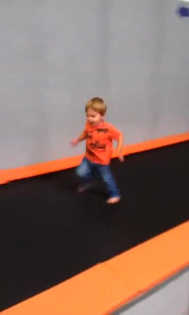 Young Little Boy Knocks Over Little Girl On Trampoline | Jukin Licensing