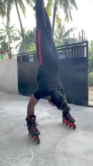 Guy Wears Rollerskates On His Hands And Balances In Handstand Position ...