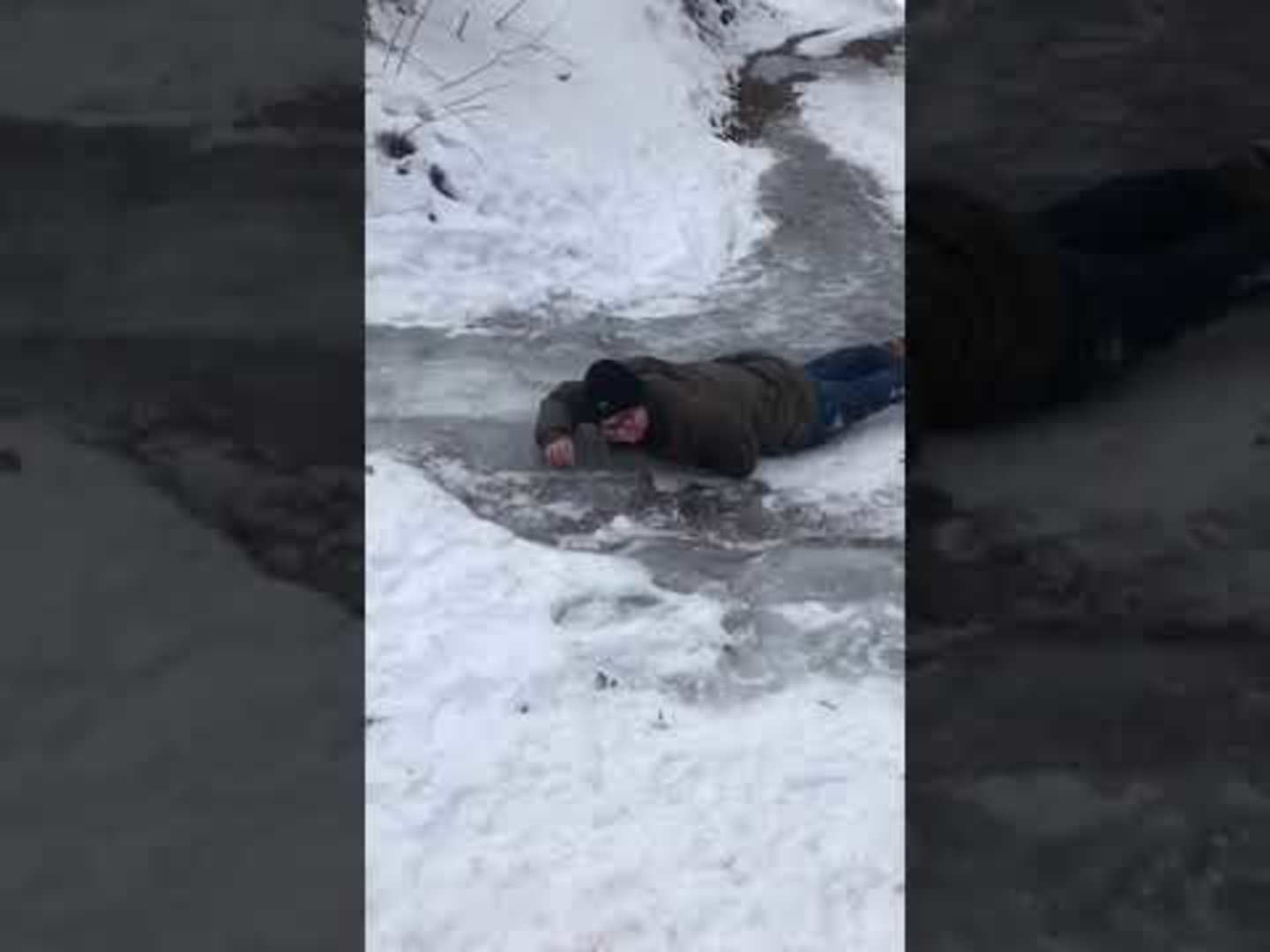 Man Slips And Slides Down Snow-covered Icy Pathway | Jukin Licensing