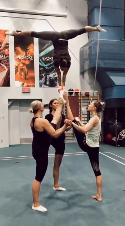 Acrobat Does Handstand While Balancing on Partners' Toes in Air | Jukin ...