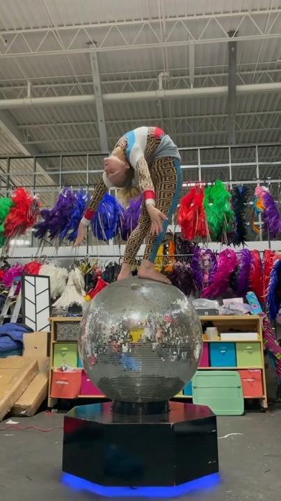 Contortionist Performs Impressive Poses on Spinning Disco Ball | Jukin ...