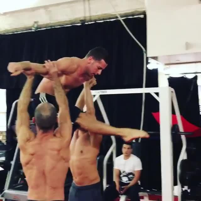 Two Men Lift Up Gymnast | Jukin Licensing